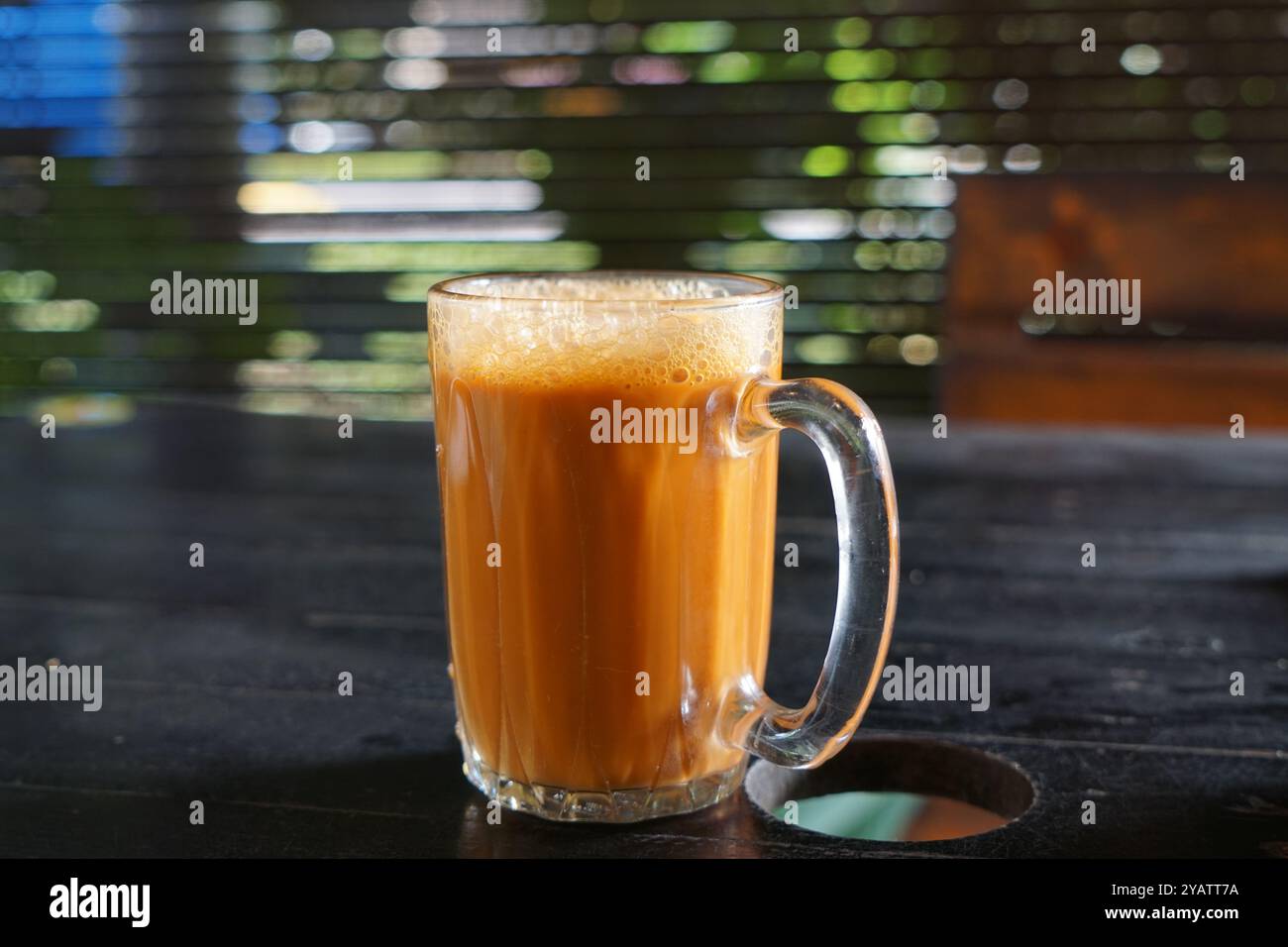 A glass of milk tea, or famously known as Teh Tarik in Malaysia Stock Photo - Alamy