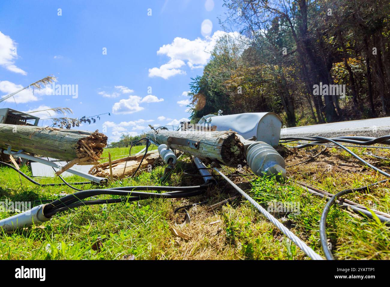 In aftermath of hurricane, damaged power lines are lying on ground with ...