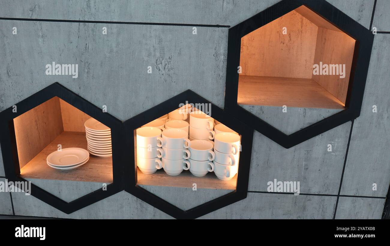 The white glass is placed in a hexagonal space Stock Photo - Alamy