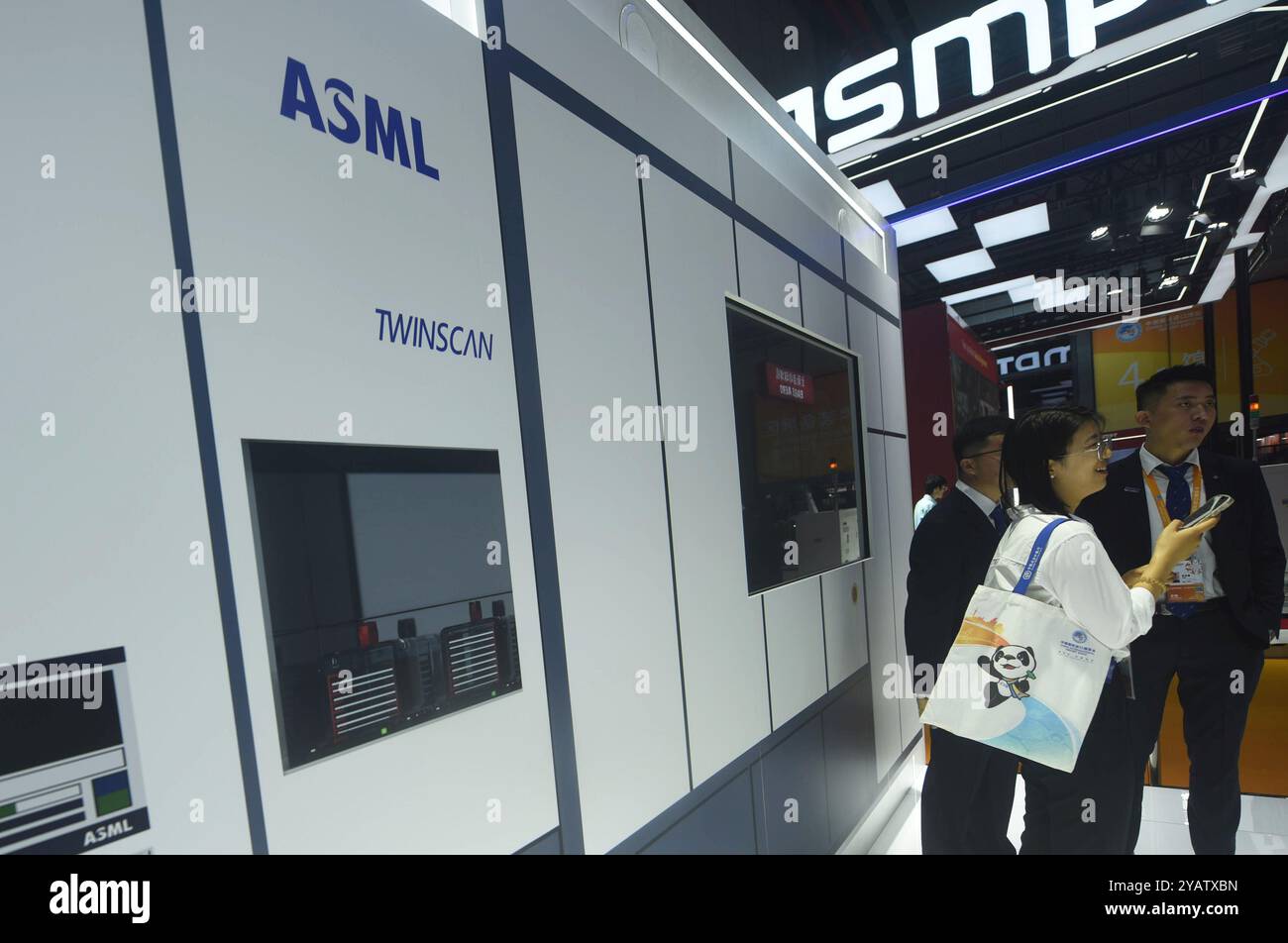 SHANGHAI, CHINA - NOVEMBER 6, 2023 - Visitors visit the stand of ASML at the 5th CIIE in ...
