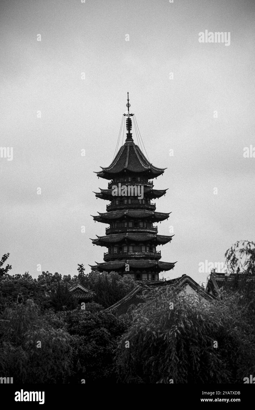 A black-and-white photograph of a traditional Chinese pagoda. The ...