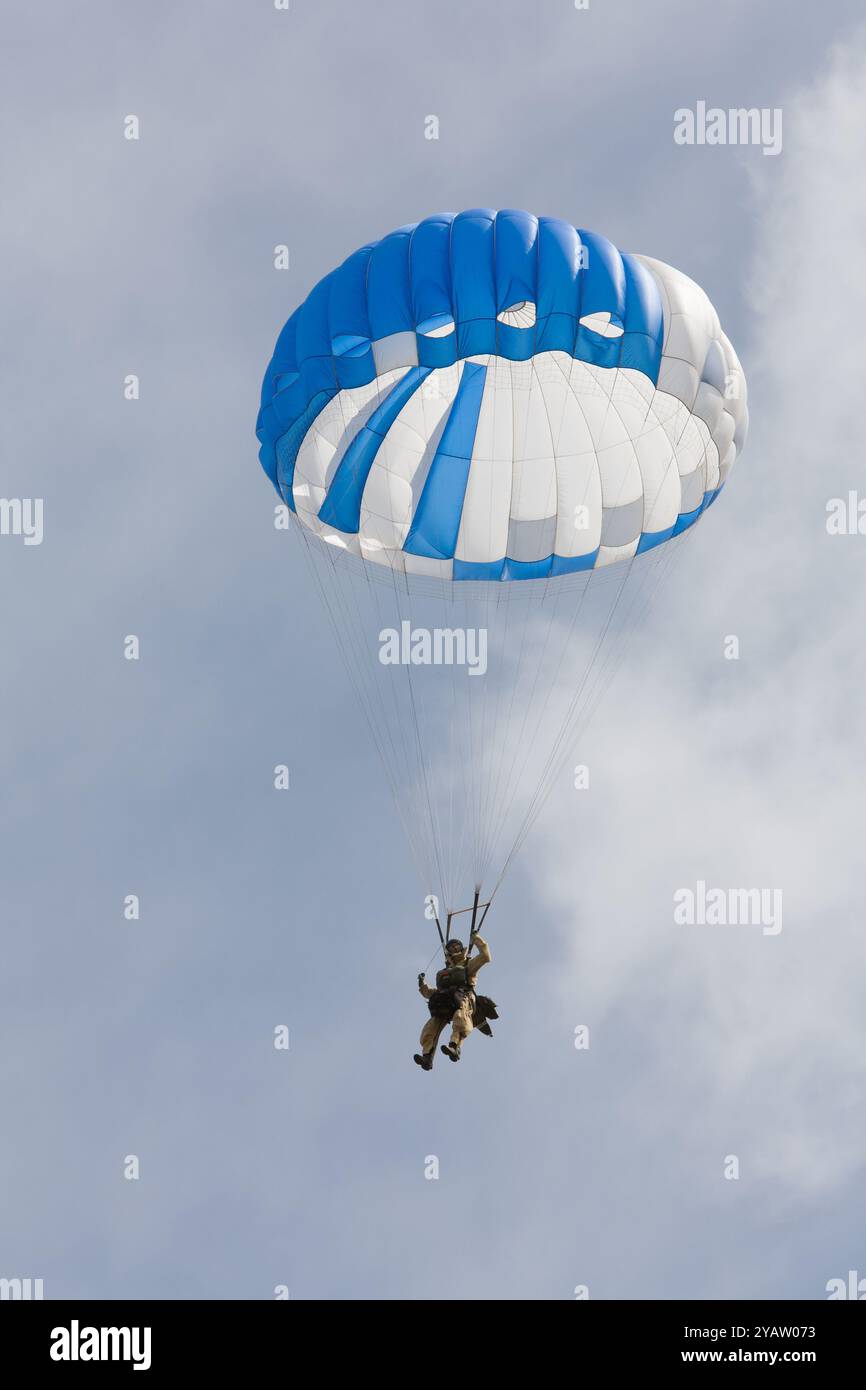 A Forest Servce smokejumper descends towards the landing zone on a ...