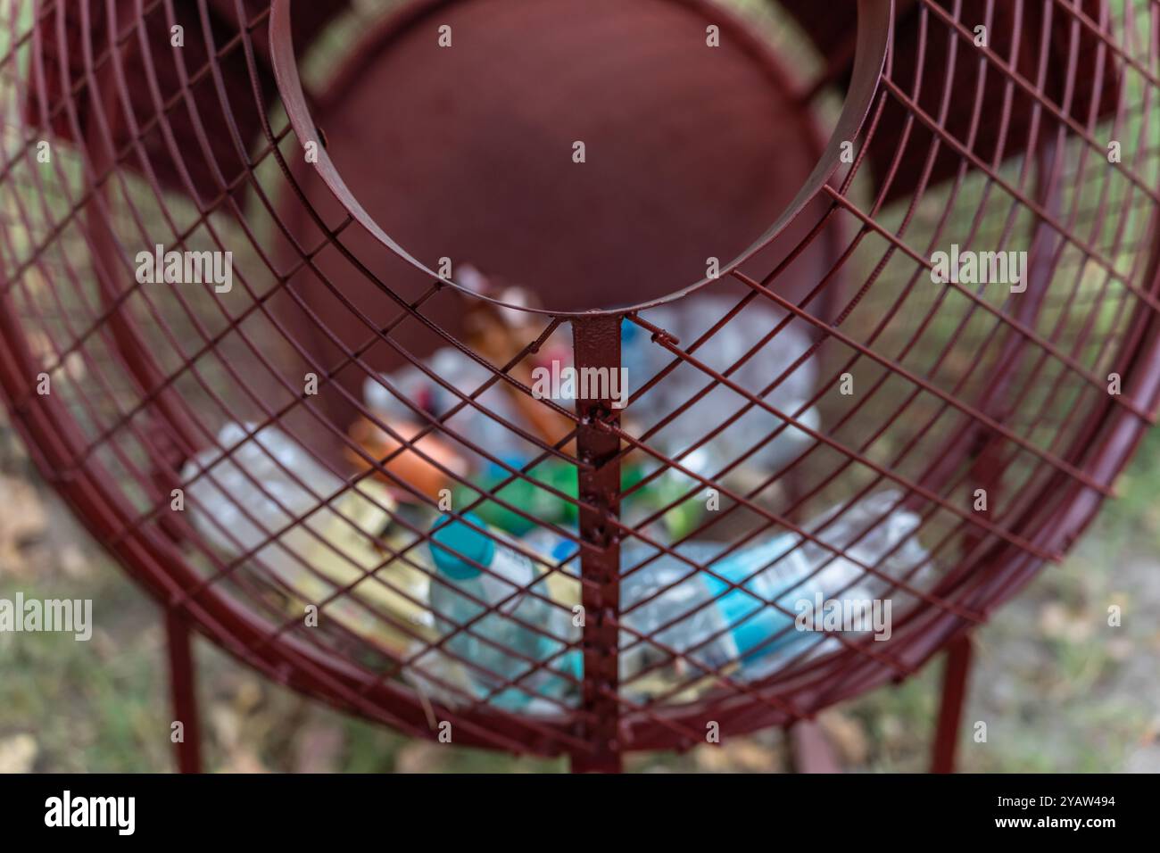 A close-up of an outdoor container for collecting plastic bottles ...
