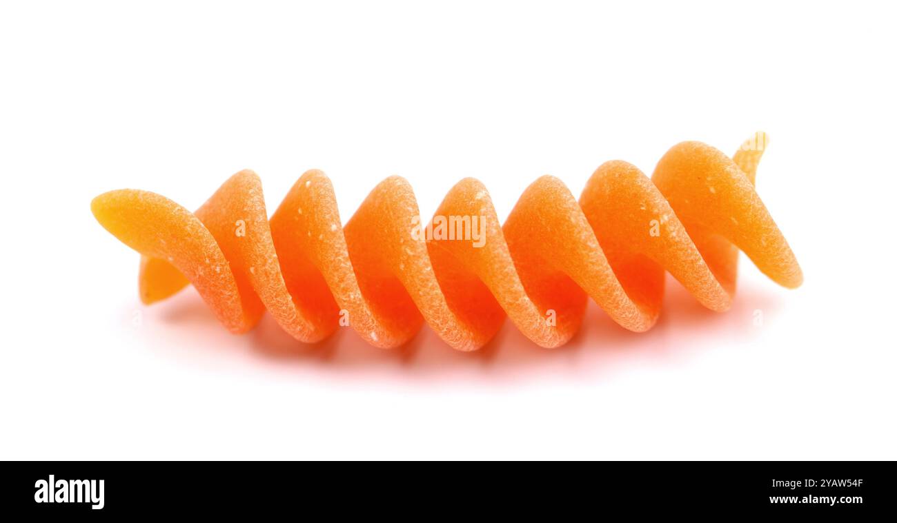 One piece of Italian red rotini pasta isolated Stock Photo - Alamy