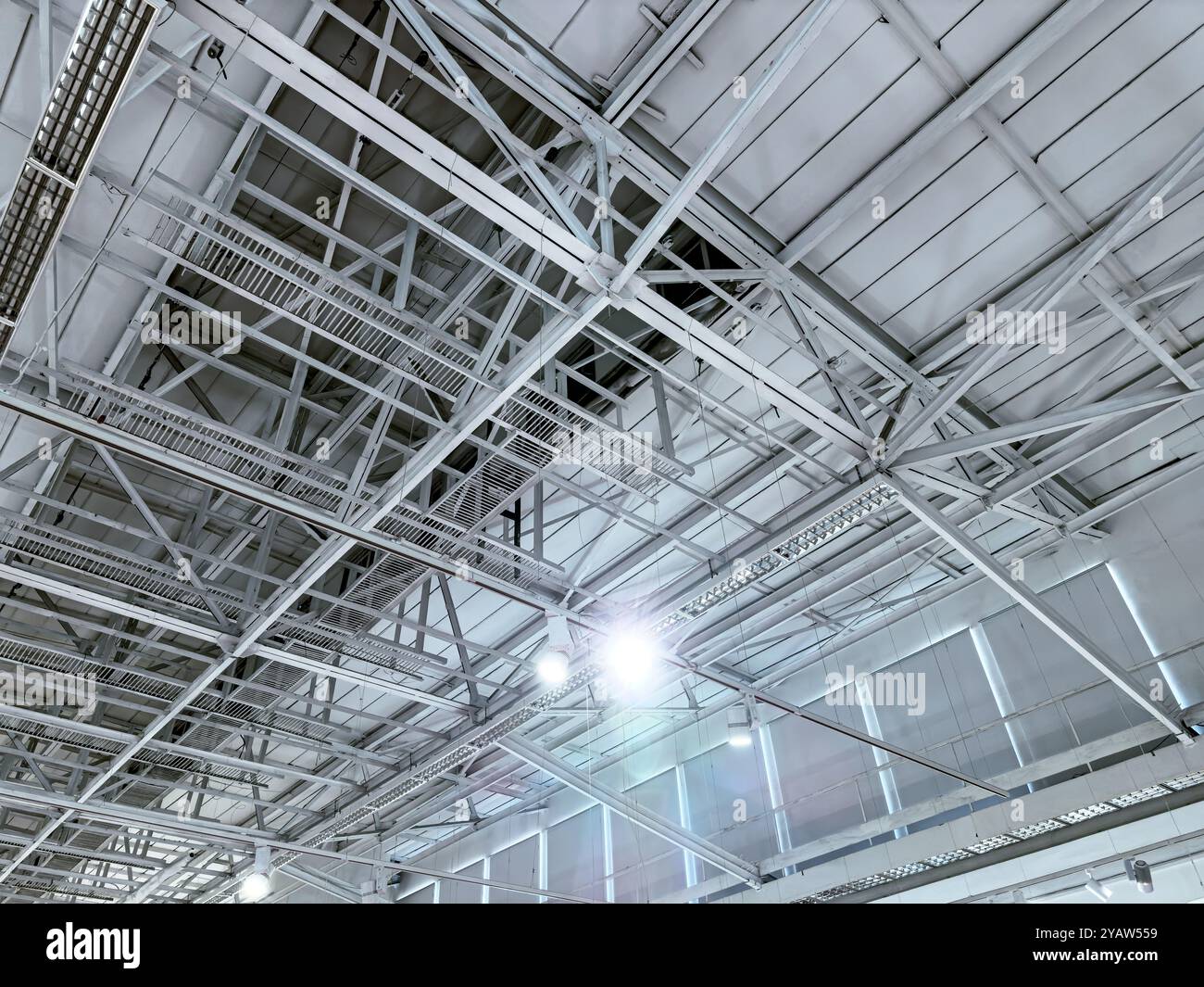 bottom view of industrial roofing with steel beams. roof of large ...