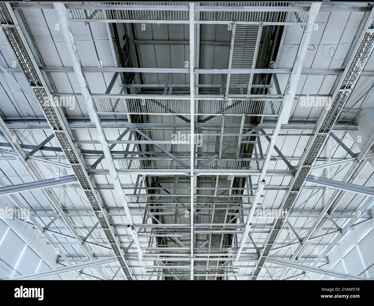 roof of large industrial building with steel beams structure. inside ...
