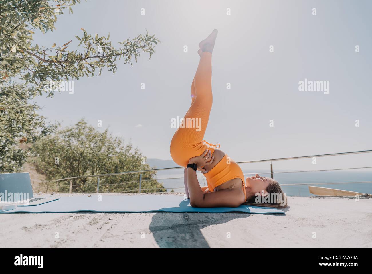Happy woman performing yoga hi-res stock photography and images - Alamy
