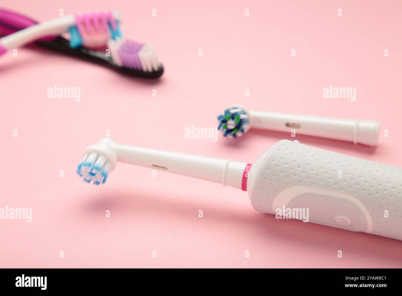 Electric and manual toothbrush on pink background. Top view Stock Photo ...