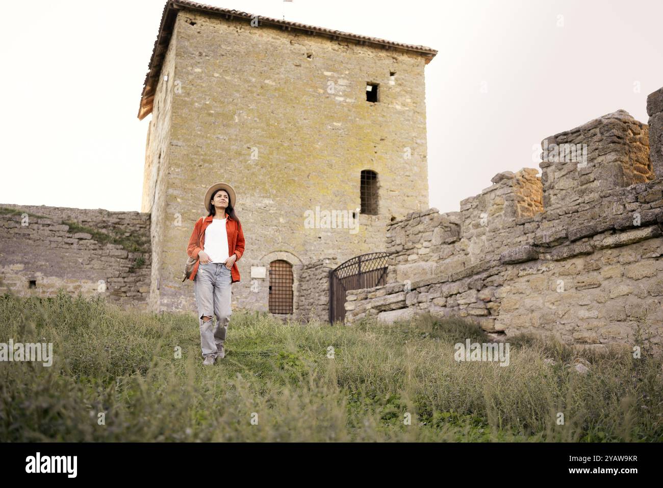 Traveler exploring an ancient fortress in Italy, enjoying a vacation ...