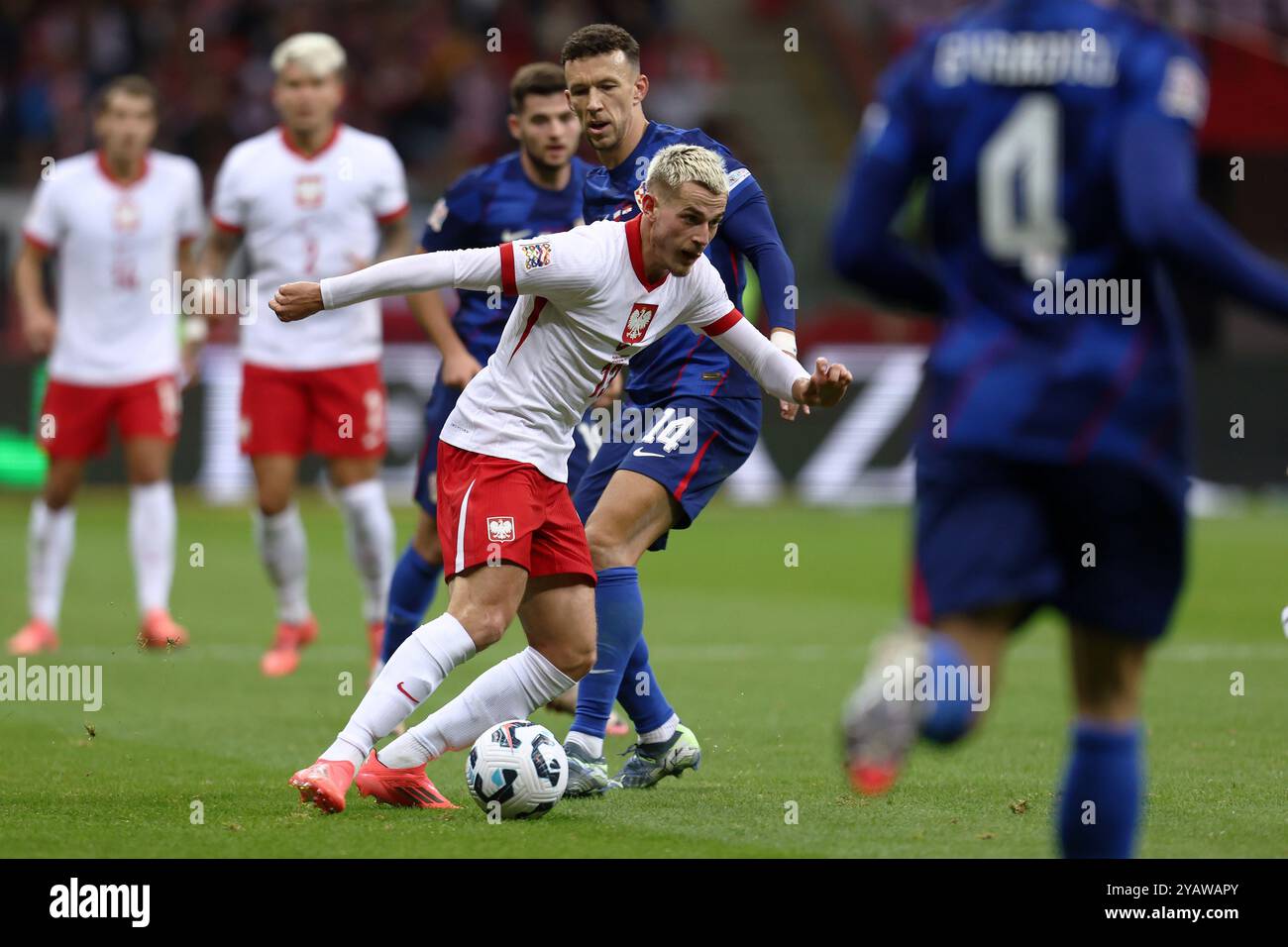 Warsaw, Poland, 15/10/2024, Ivan Perisic of Croatia and Jakub Kaminski ...