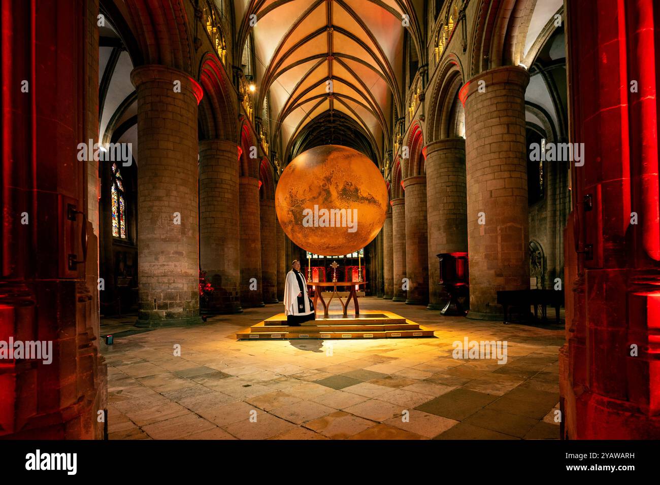 The Very Reverend Andrew Zihni, Dean of Gloucester, admires an artwork ...