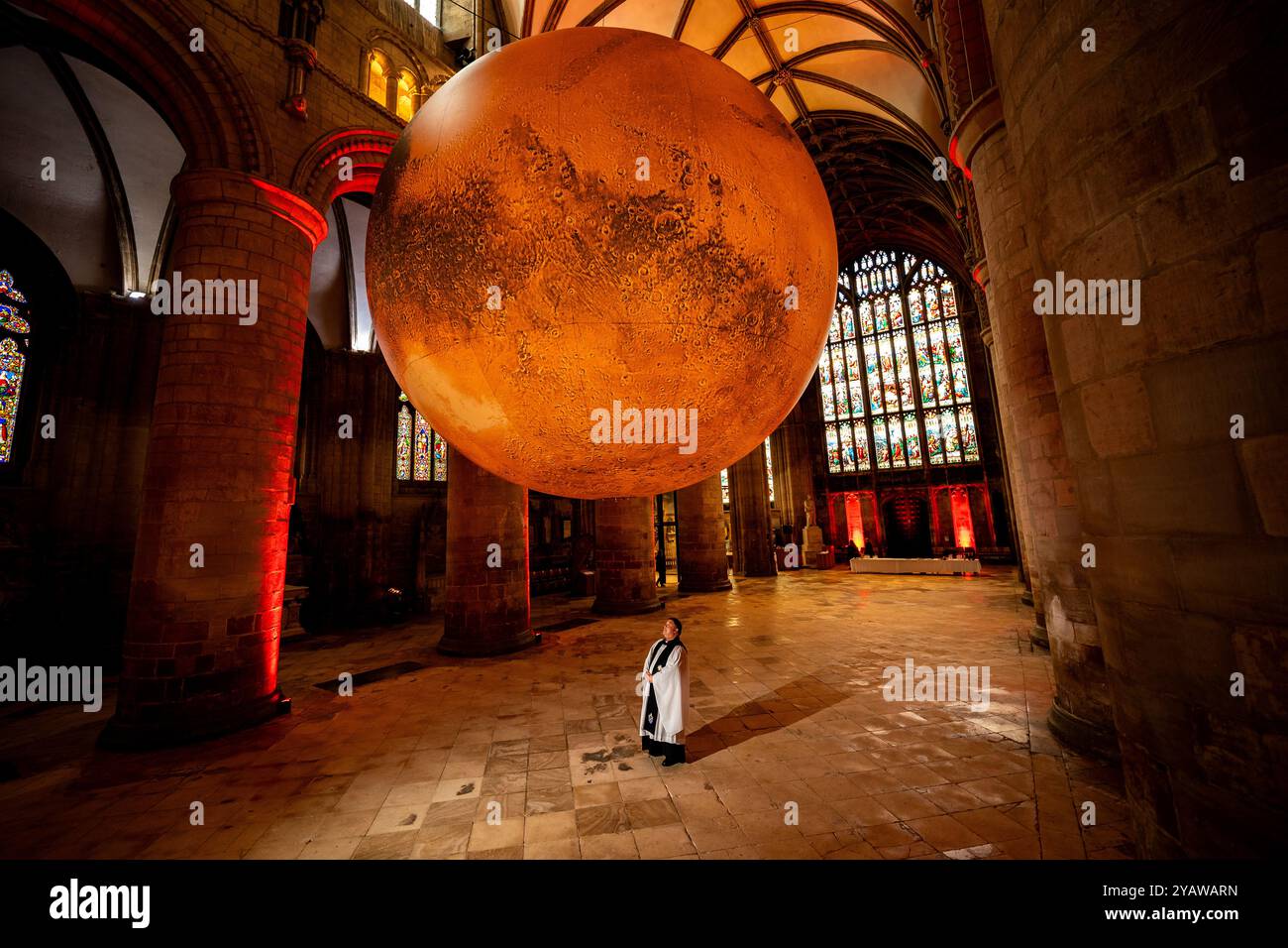 The Very Reverend Andrew Zihni, Dean of Gloucester, admires an artwork ...