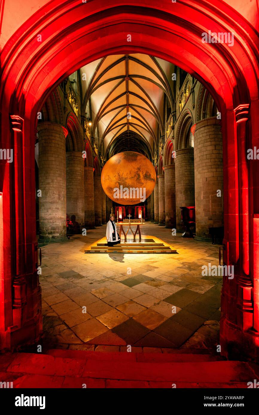 The Very Reverend Andrew Zihni, Dean of Gloucester, admires an artwork ...