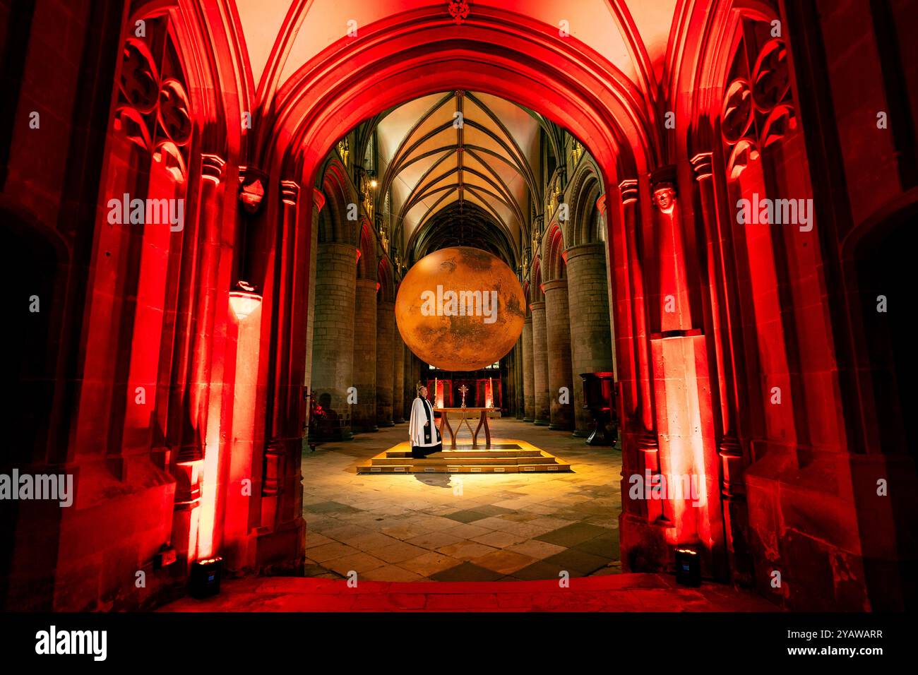 The Very Reverend Andrew Zihni, Dean of Gloucester, admires an artwork ...