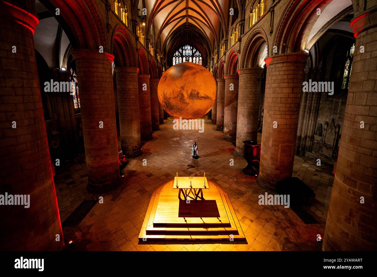 The Very Reverend Andrew Zihni, Dean of Gloucester, admires an artwork ...