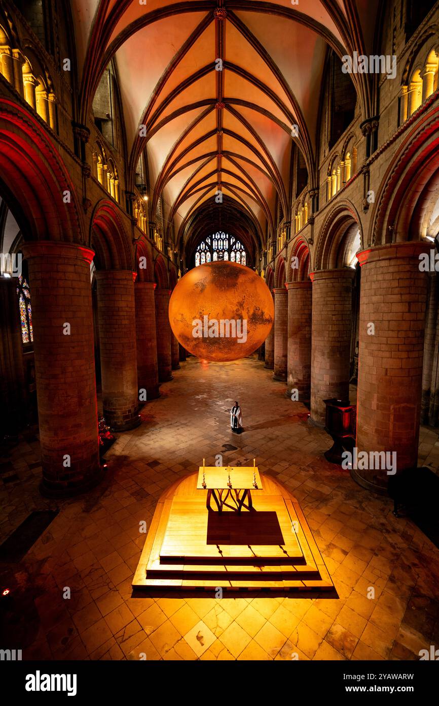 The Very Reverend Andrew Zihni, Dean of Gloucester, admires an artwork ...