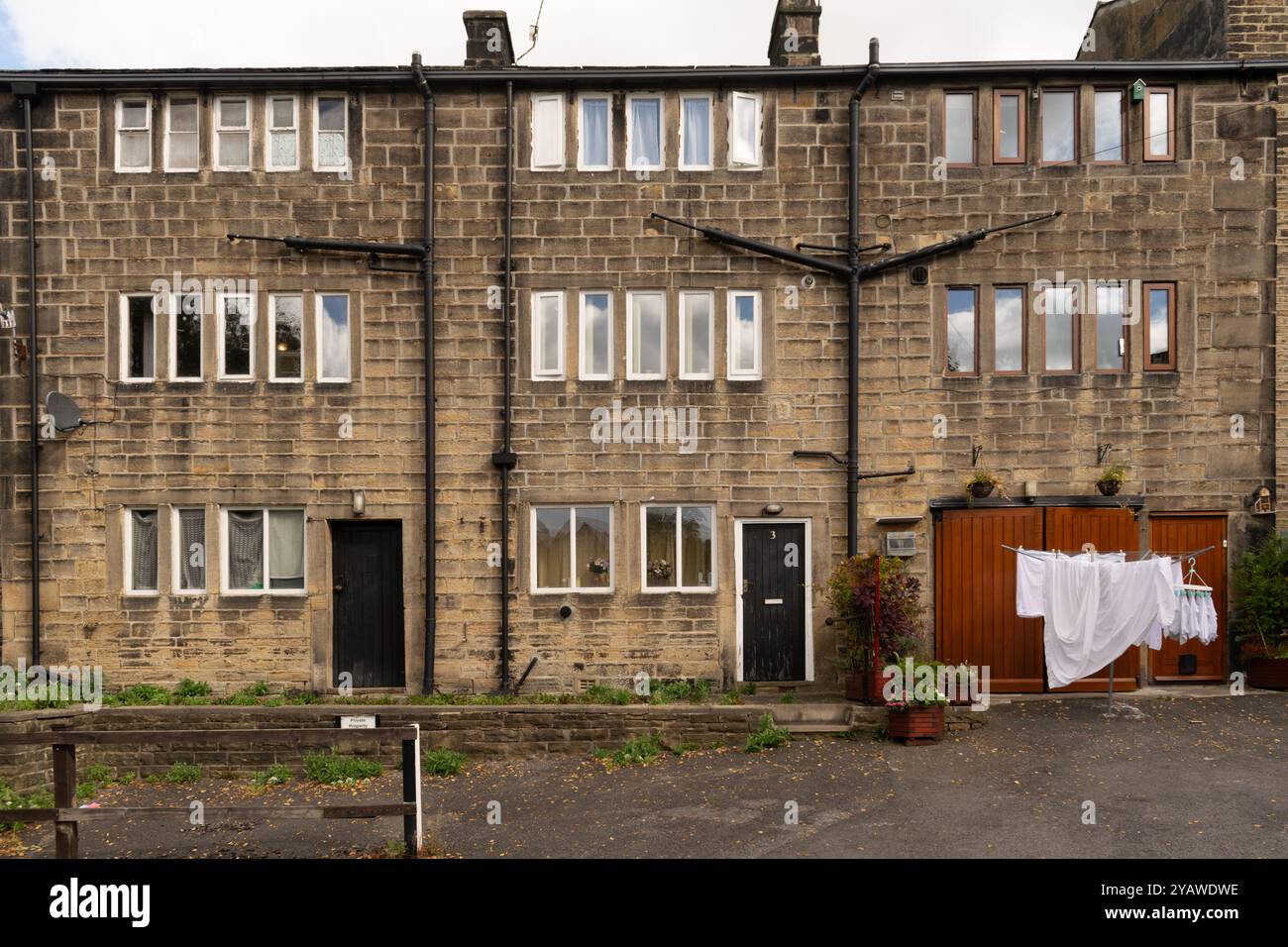 Weavers cottage, three storey with distinctive window. Clothes drying ...