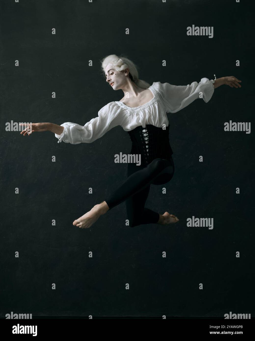 Young man, ballet dancer, dressed as medieval person dancing in motion ...