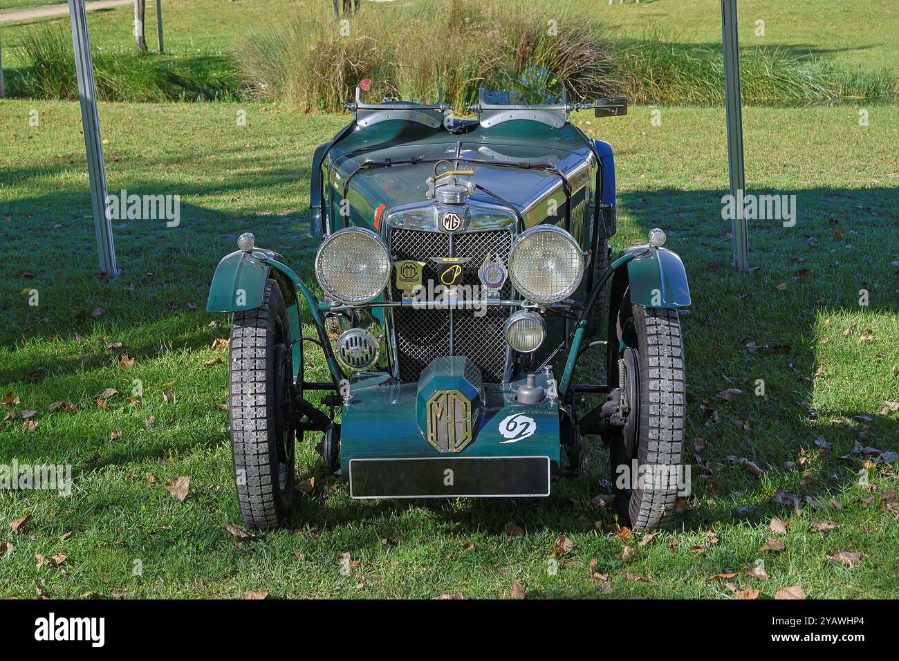Classic green mg sports car parked on grass at an outdoor car show ...