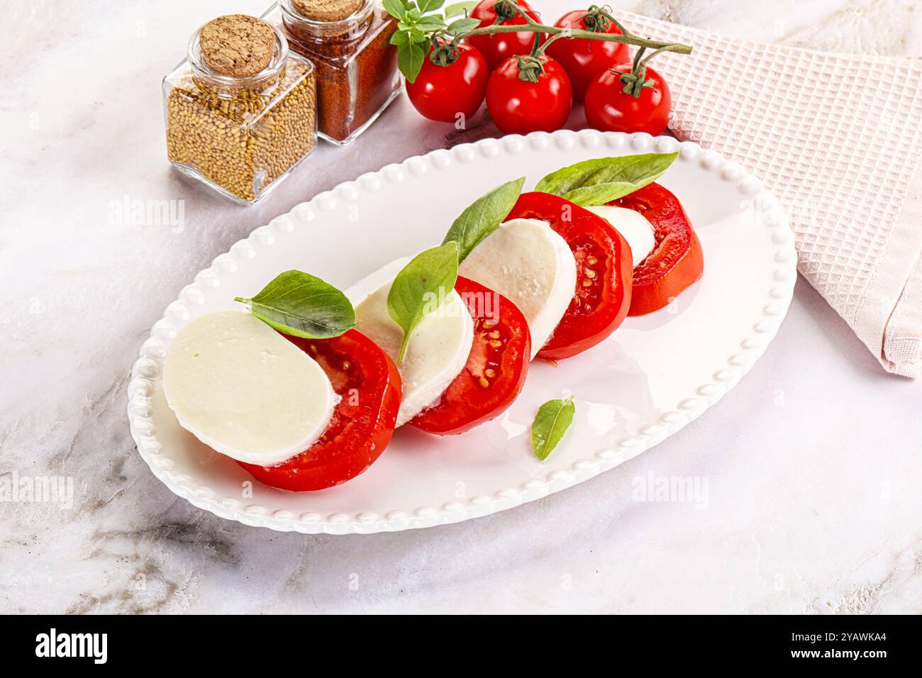 Italian caprese salad with mozzarella, tomato and basil Stock Photo - Alamy