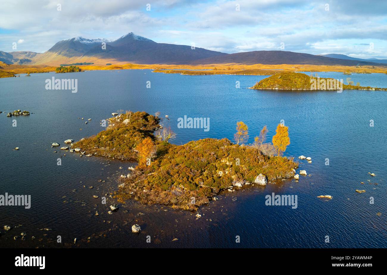 Aerial view from drone of small islands in autumn foliage on Lochan na ...