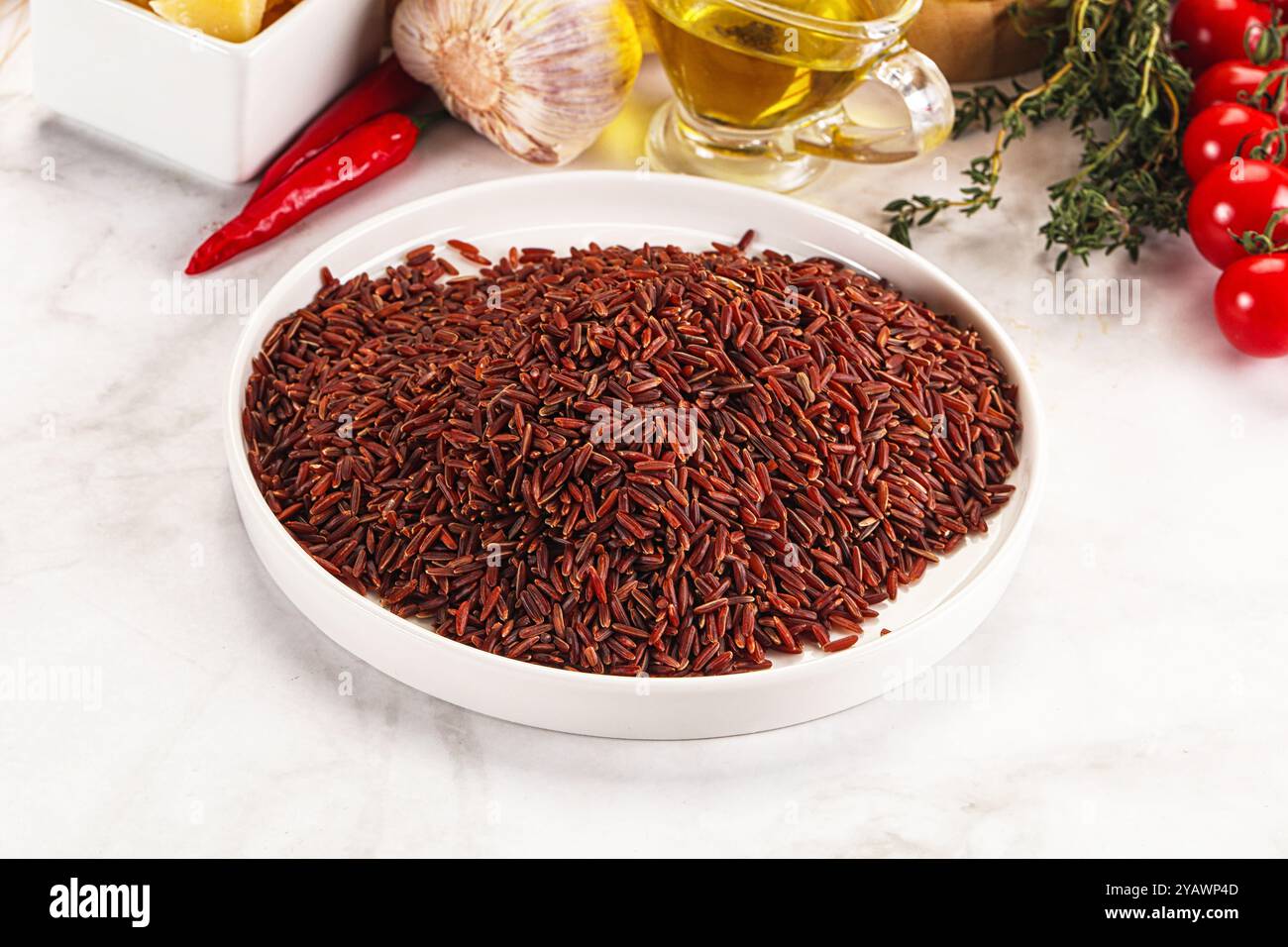 Red raw dry rice grain gor cooking Stock Photo - Alamy