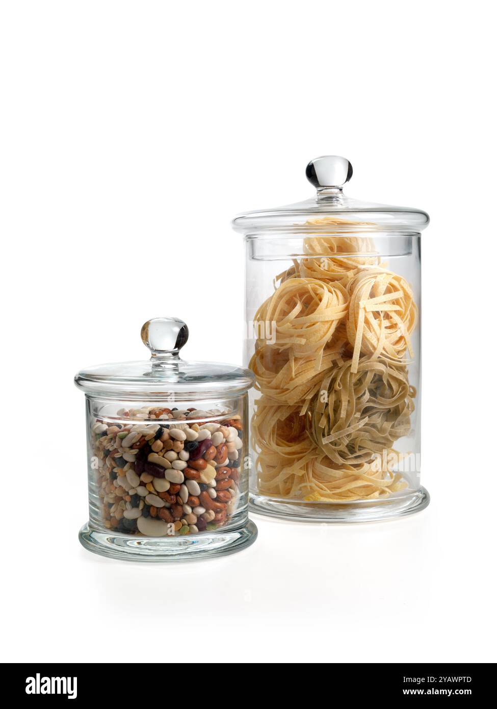 Still life of a transparent glass container for pasta, on a white ...