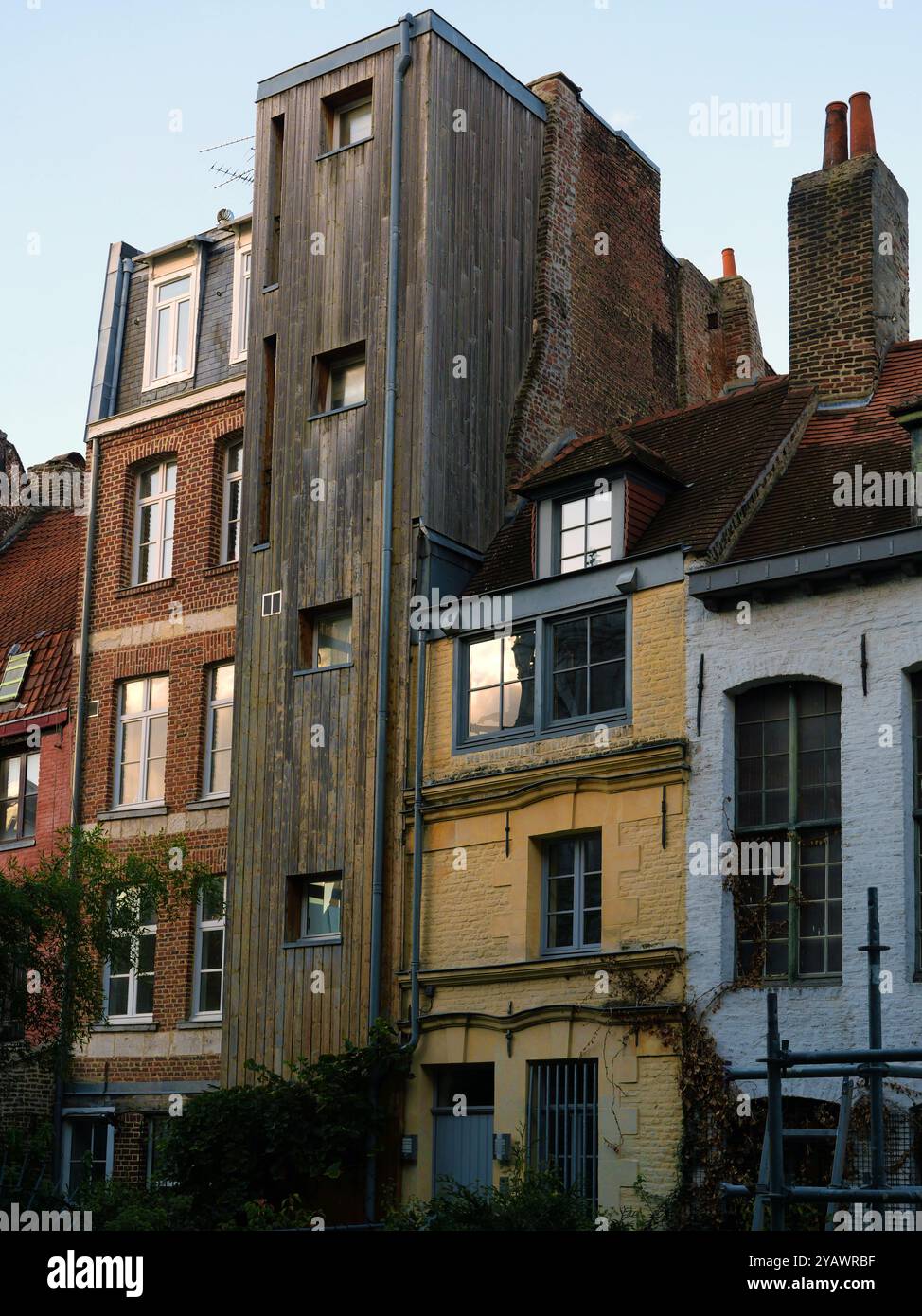 France. Lille, small houses with brick facades. A facade redone in wood ...