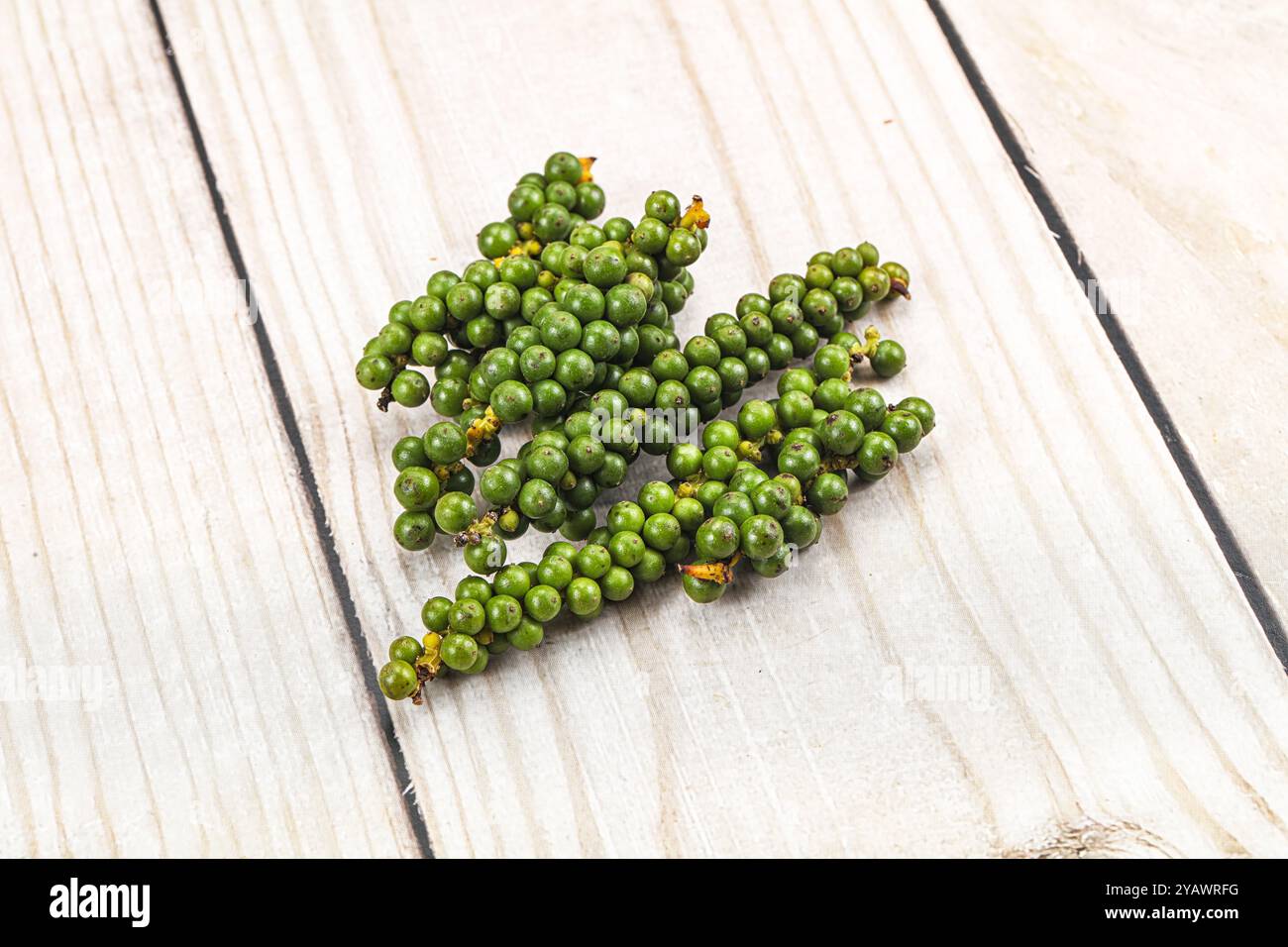 Green pepper corn on the branch heap Stock Photo - Alamy