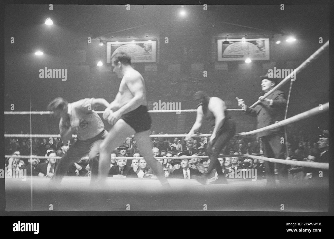 Wrestling. Yvon Robert and a wrestler wearing green mask pseudonym or ...