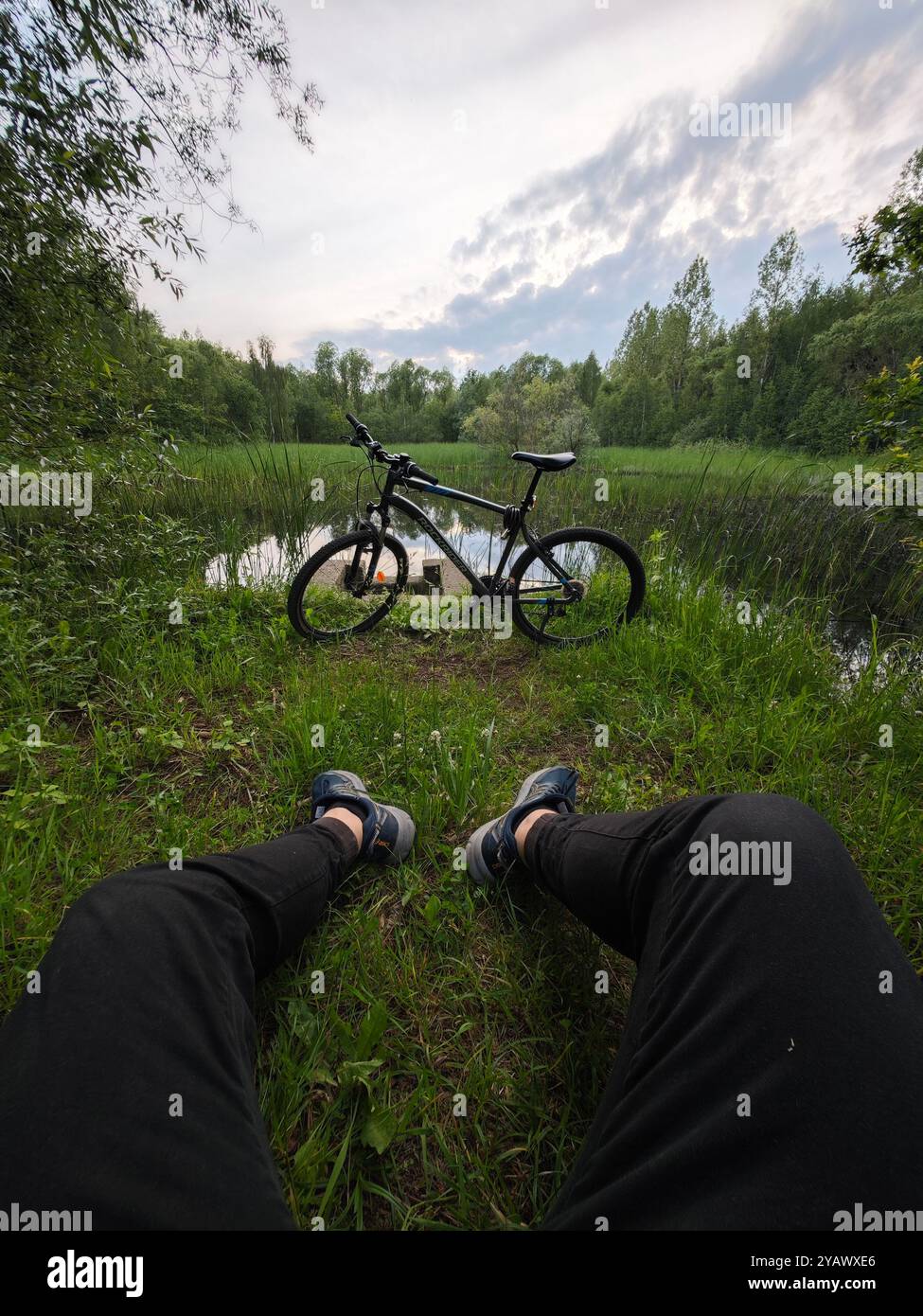 "Mountain bike resting on a quiet suburban street at dusk, illuminated ...