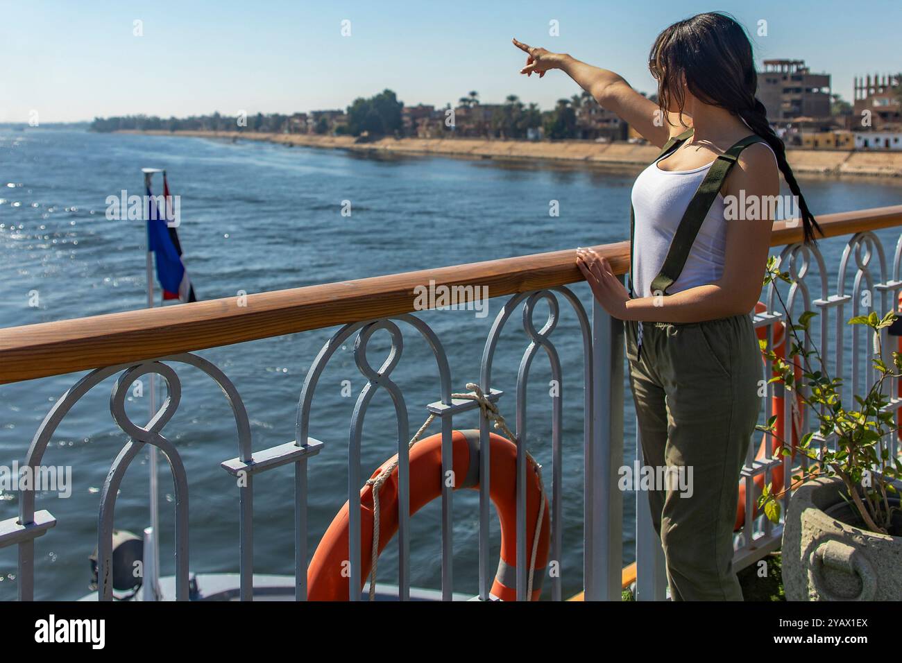 Tourist discovering the mysteries of Egypt on a solo cruise on the Nile ...