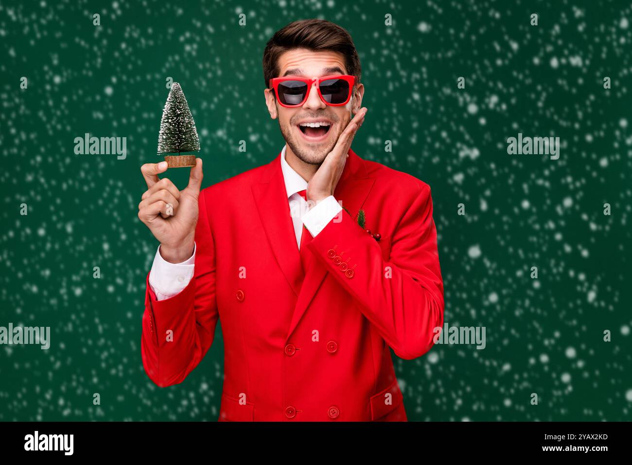 Portrait of attractive stunned funny imposing cheerful guy holding in ...