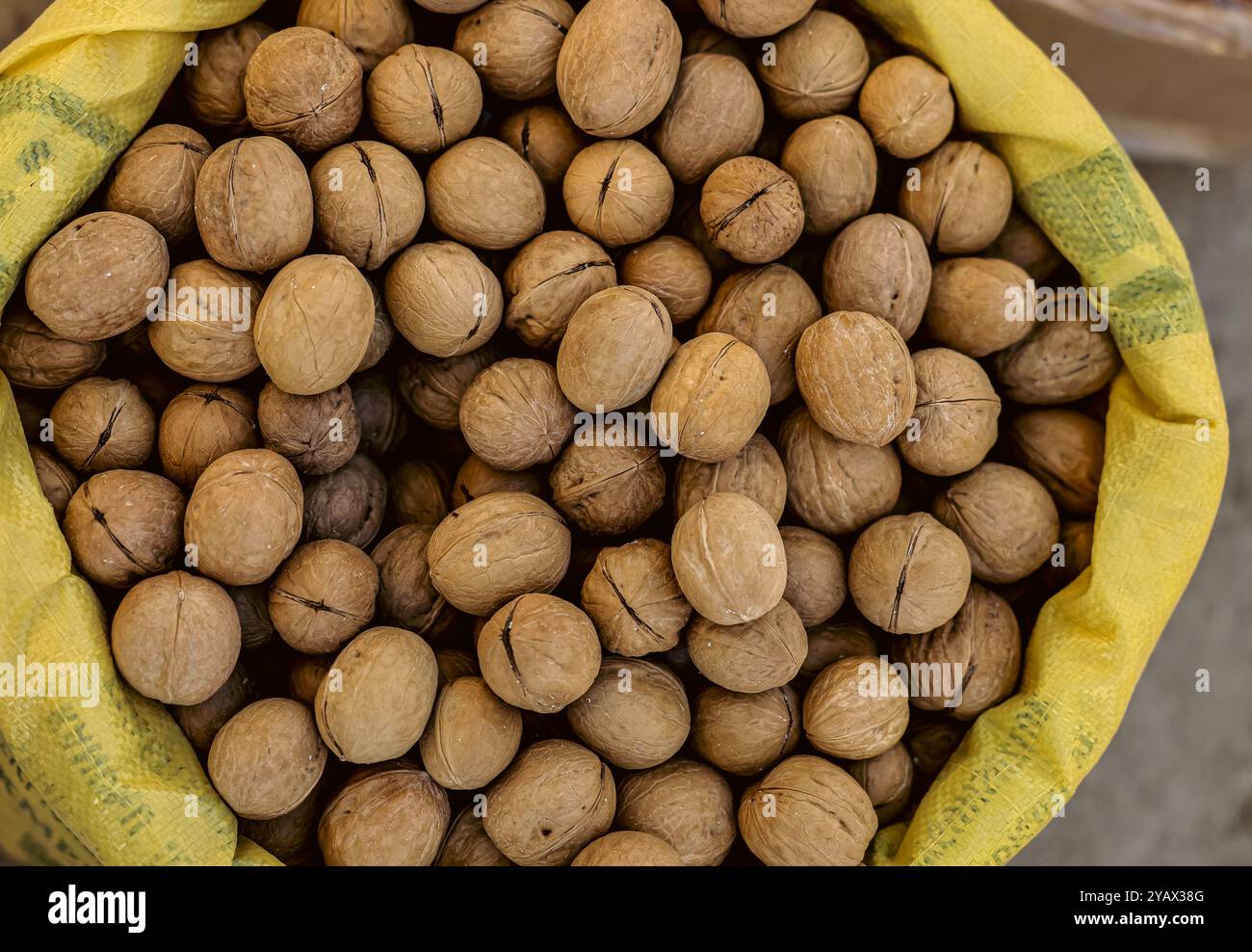 A burlap sack filled with an assortment of traditional Turkish nuts is ...