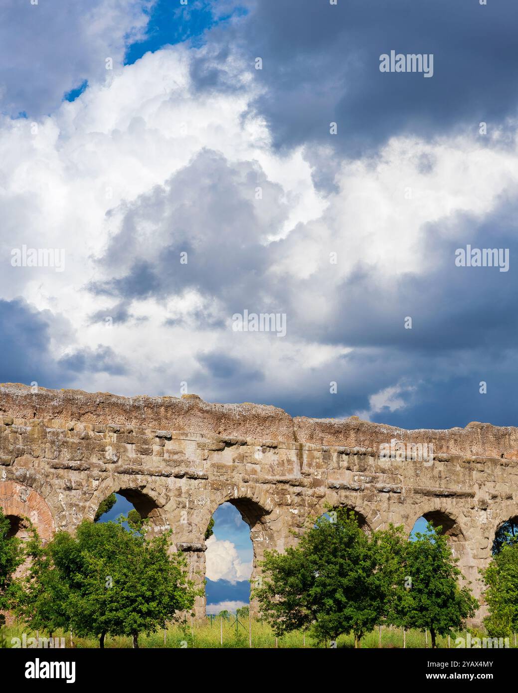 Ancient roman aqueduct beautiful arches ruins in Rome public park with ...