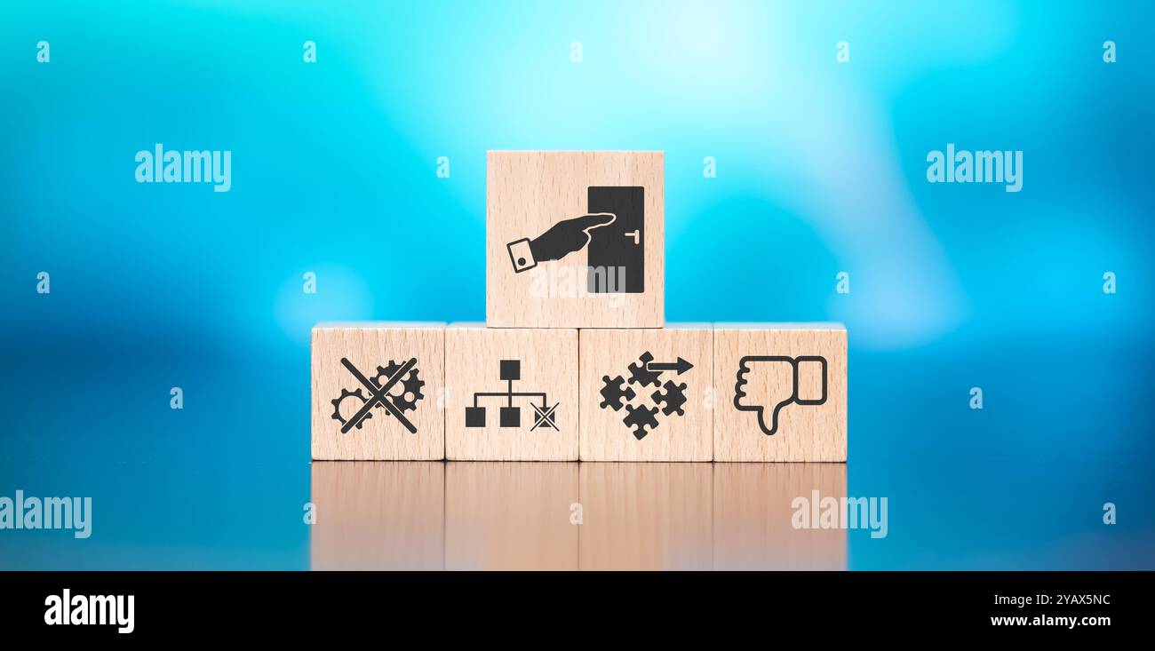 Wooden blocks with symbol of job loss concept on blue background Stock ...