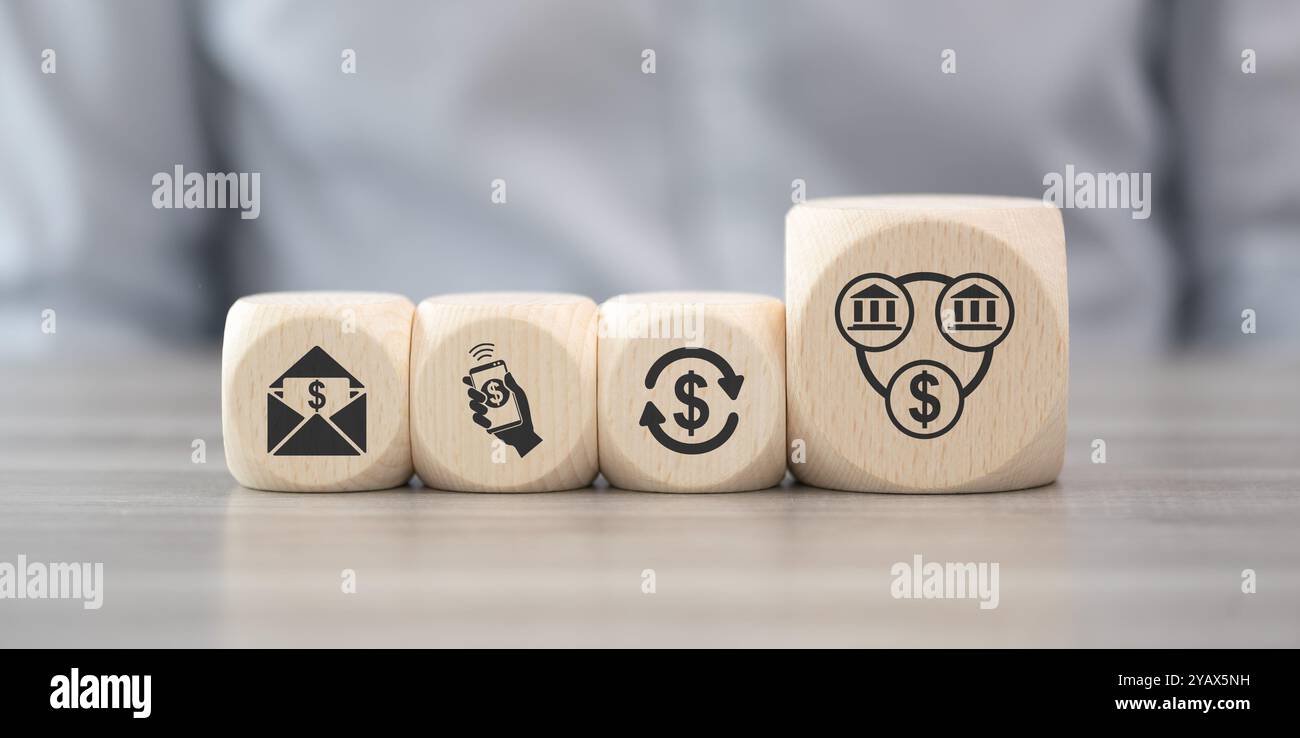 Wooden blocks with symbol of money transfer concept Stock Photo - Alamy