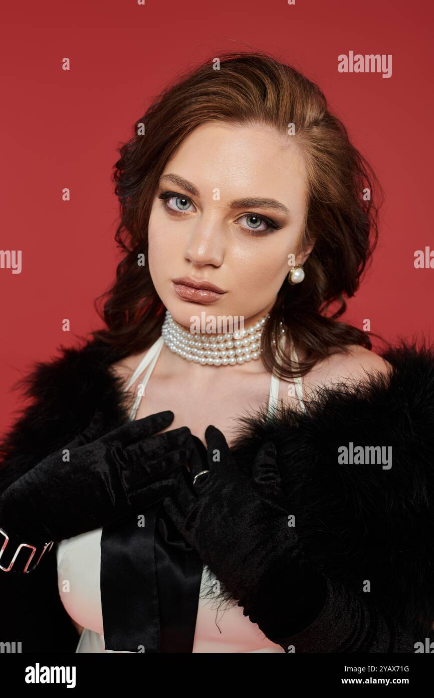 A young beautiful woman exudes sophistication in her elegant outfit and glamorous accessories ...