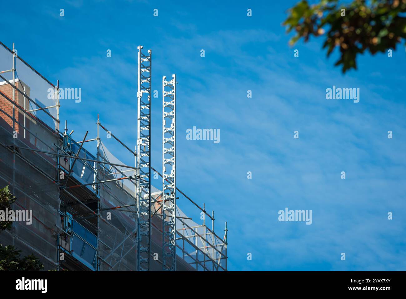 Scaffold sheeting net wrapped apartments building during insulation in ...