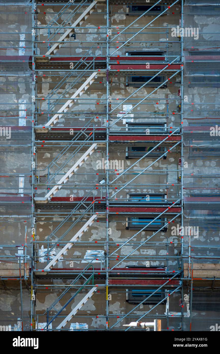 Scaffold sheeting net wrapped apartments building during insulation in ...