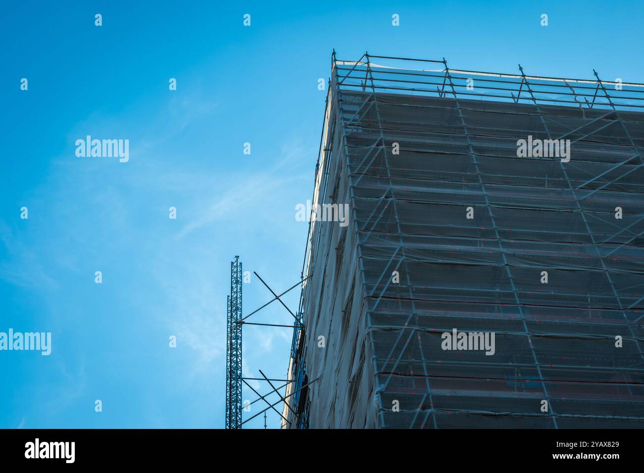 Scaffold sheeting net wrapped apartments building during insulation in ...