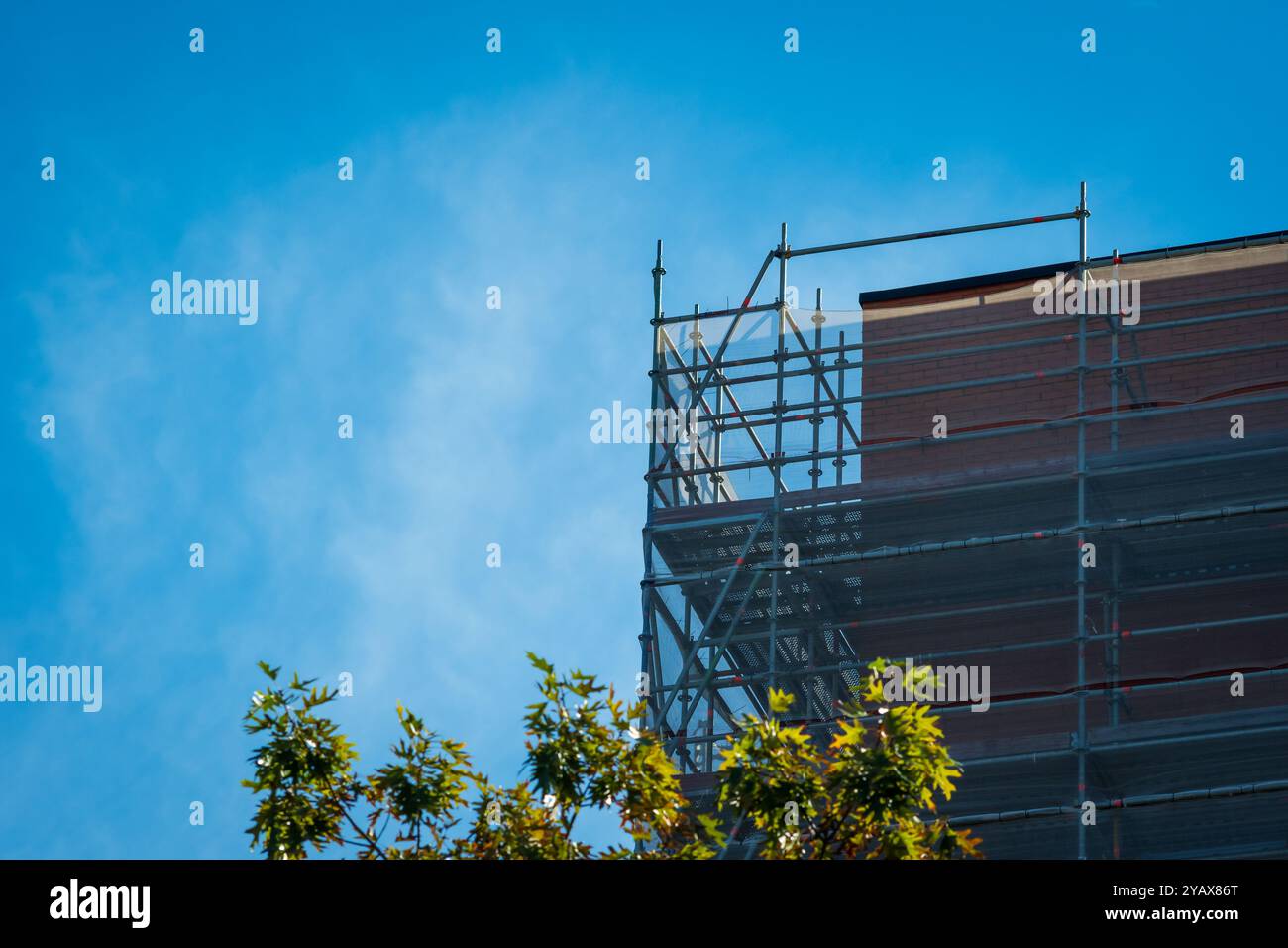 Scaffold sheeting net wrapped apartments building during insulation in ...