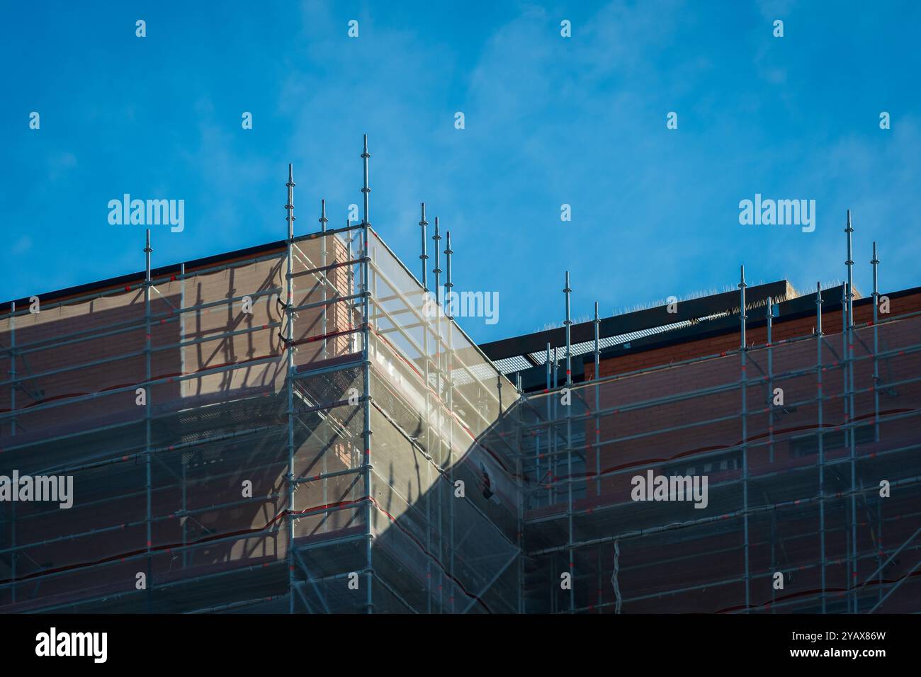 Scaffold sheeting net wrapped apartments building during insulation in ...