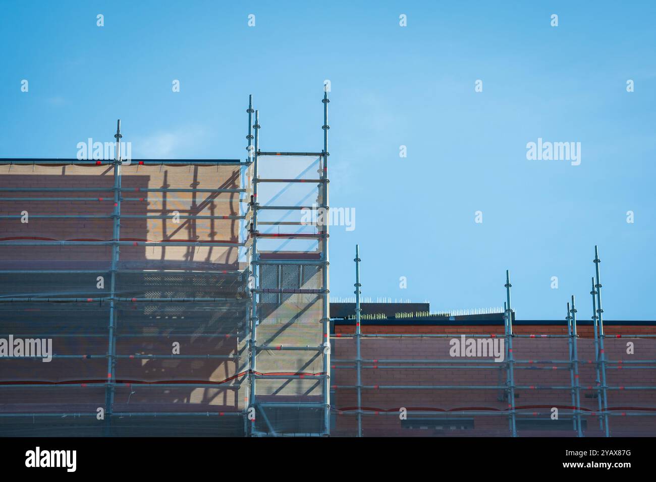 Scaffold sheeting net wrapped apartments building during insulation in ...
