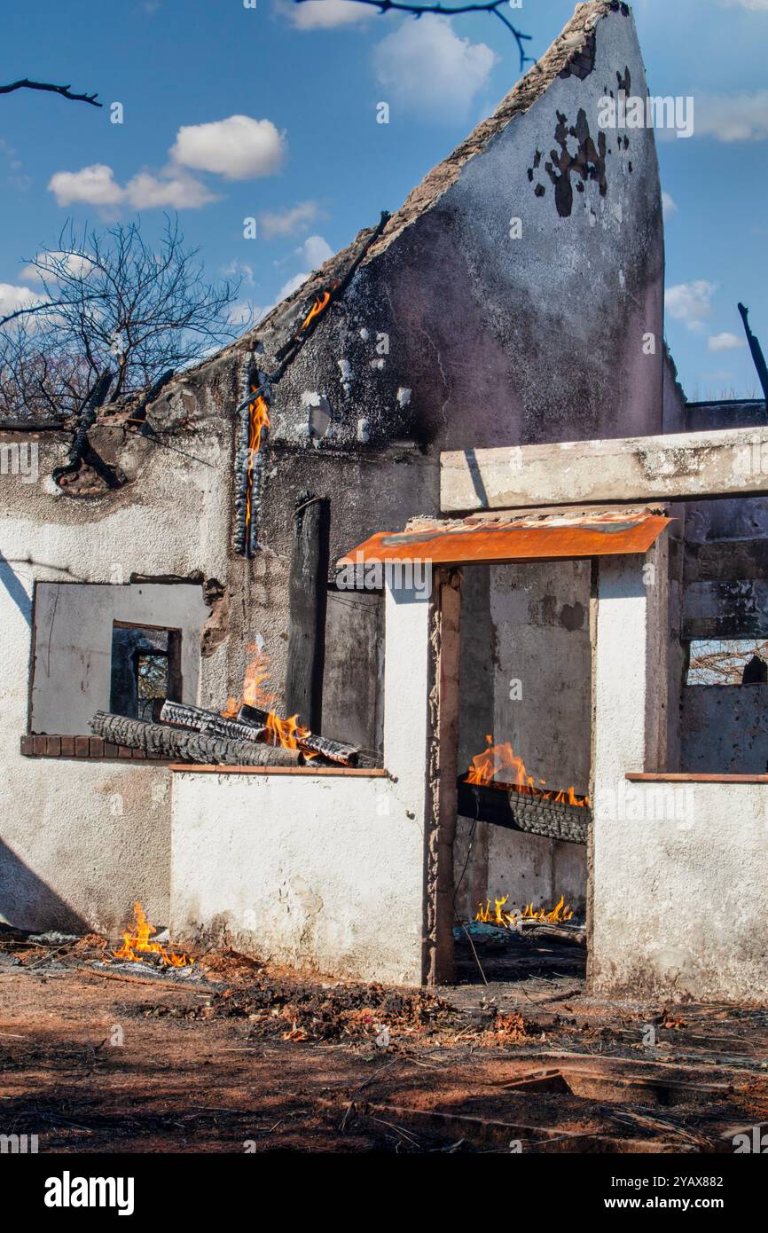 burned down house insurance claim, flames still ongoing Stock Photo - Alamy