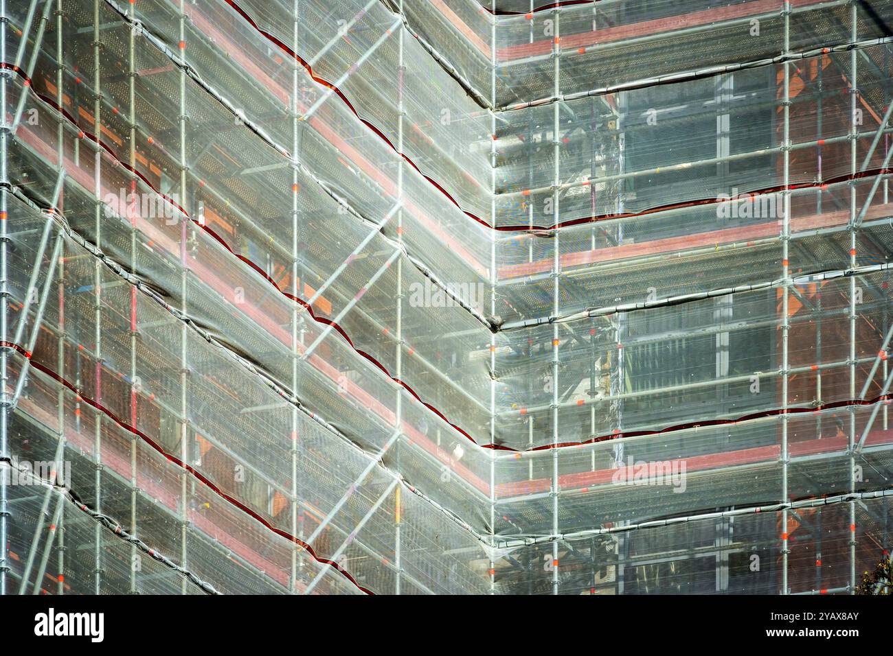 Scaffold sheeting net wrapped apartments building during insulation in ...