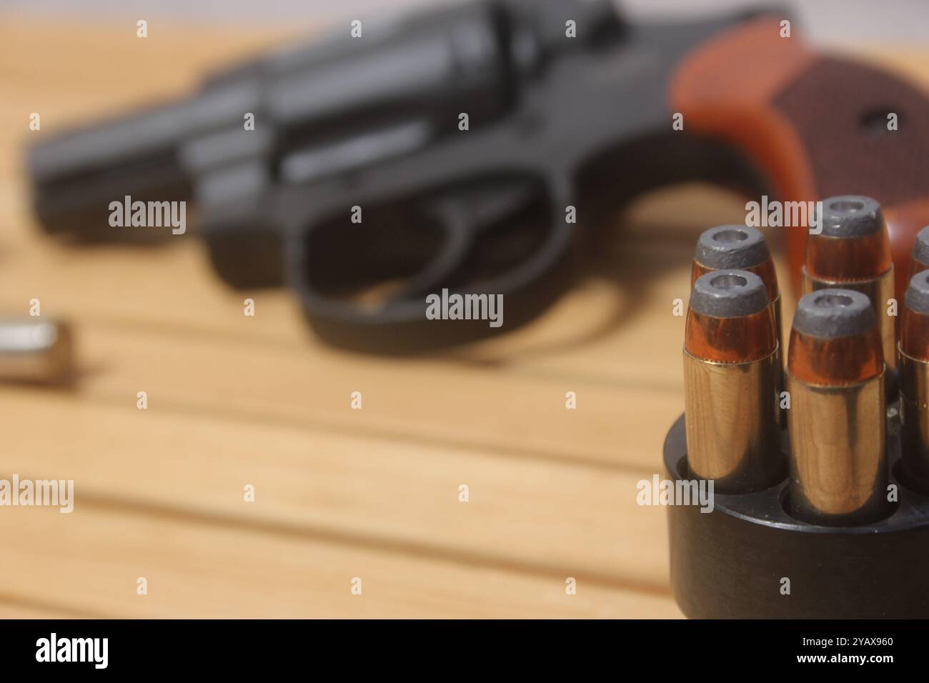 Vintage Revolver Gun With Ammo and Speed Loader Stock Photo - Alamy