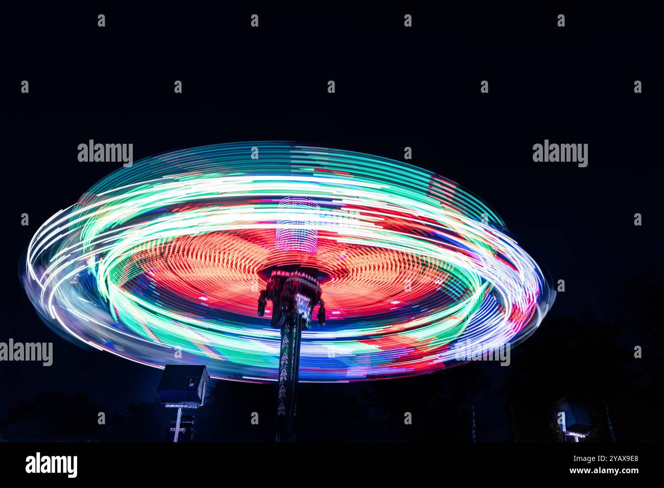 Light trails from the 'Star Flier' fairground ride at the annual ...