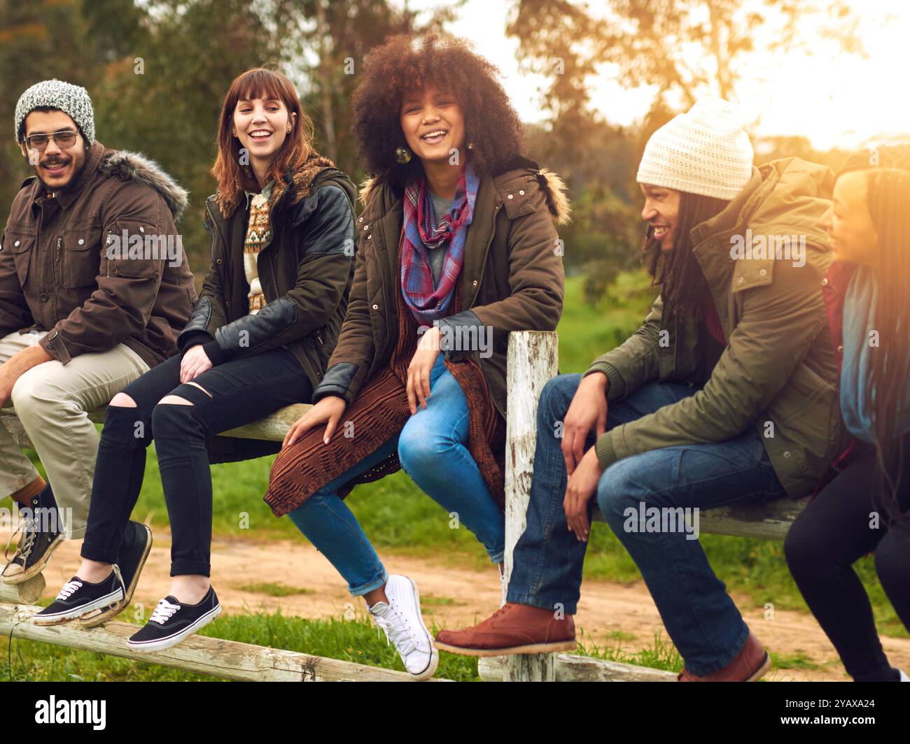 Group friends talking outside sunset hi-res stock photography and ...