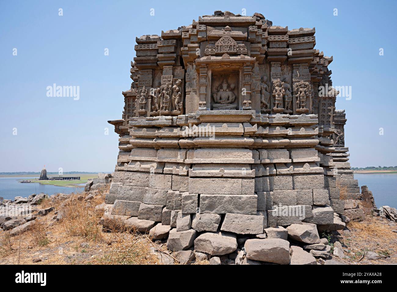 Carved idols on the outer wall of an old temple, near Palasdev Temple ...